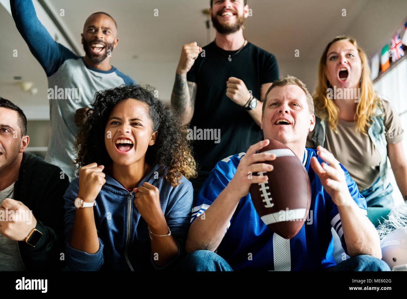 Woman cheering sports team home hi-res stock photography and images - Alamy