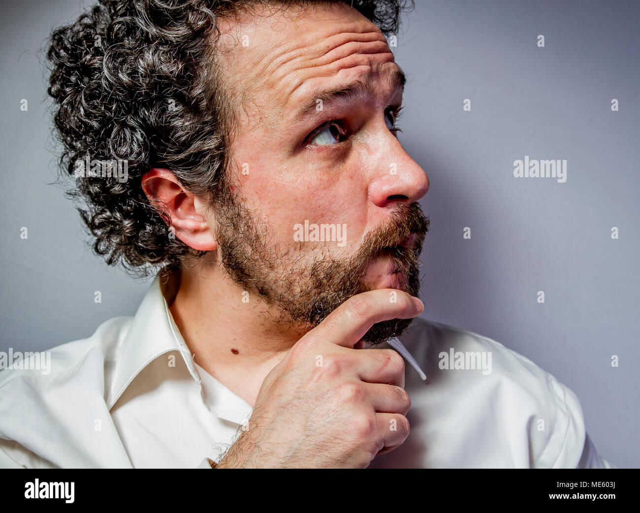 Fear, man with intense expression, white shirt Stock Photo - Alamy