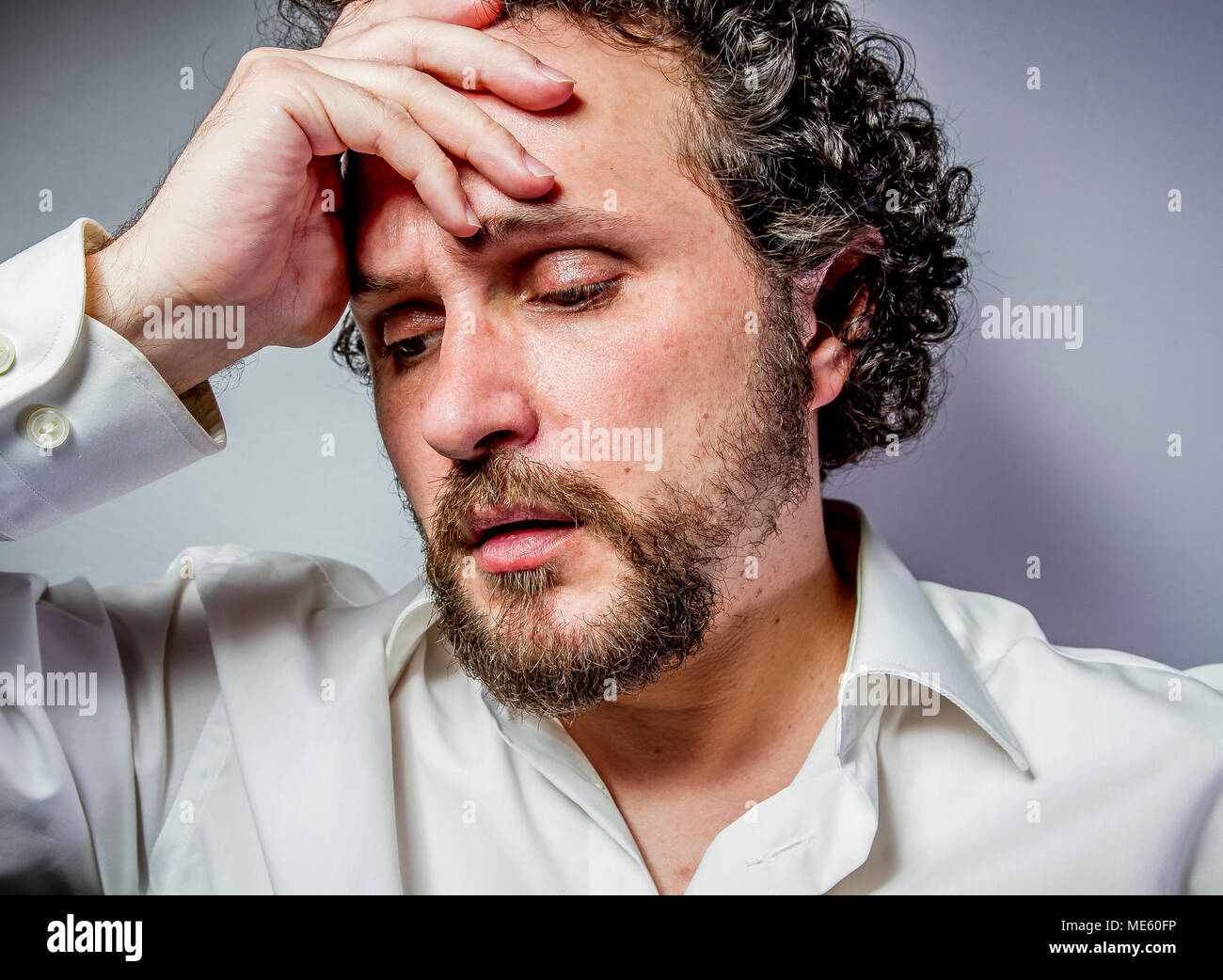 sad face, man with intense expression, white shirt Stock Photo - Alamy