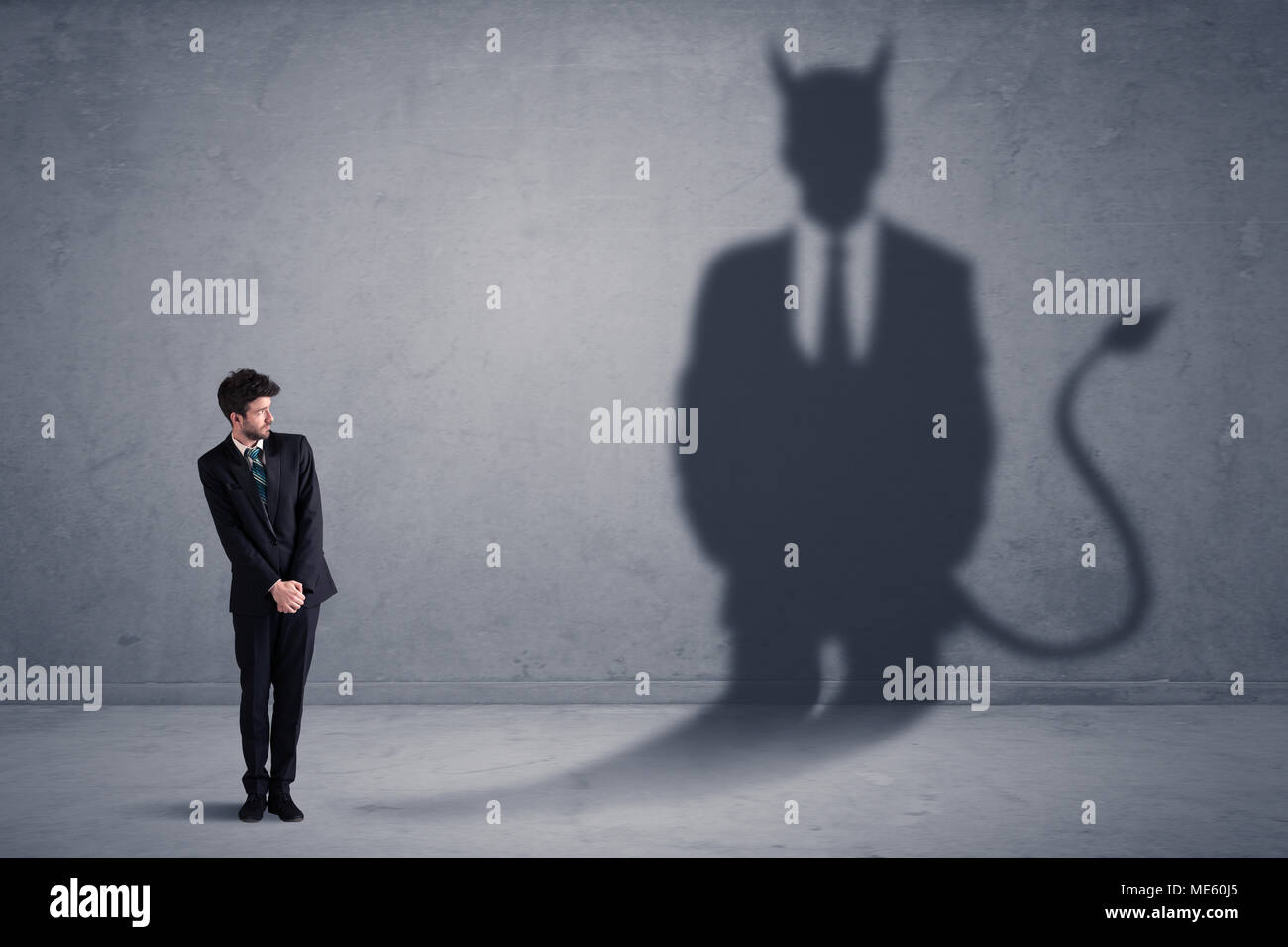 Business man looking at his own devil demon shadow concept background ...