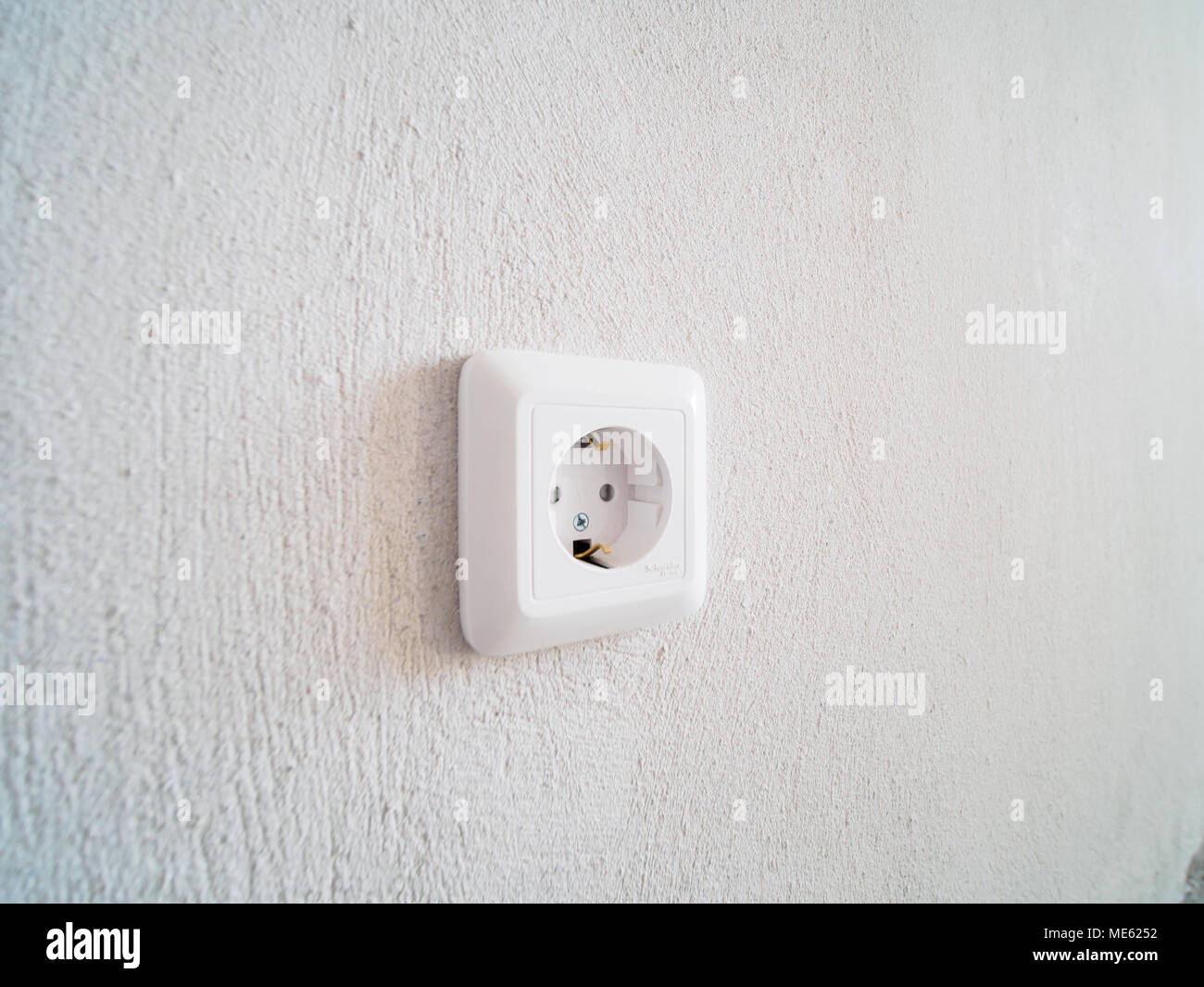 Power socket in concrete wall Stock Photo - Alamy