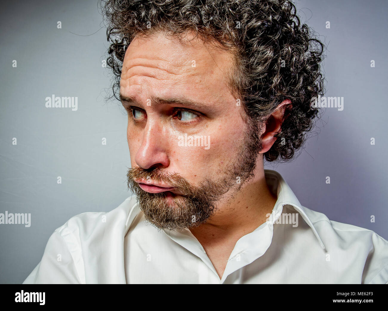 sad face, man with intense expression, white shirt Stock Photo - Alamy