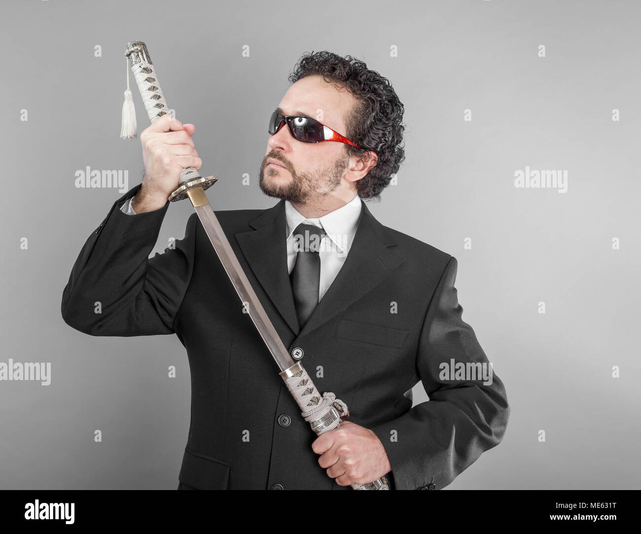Businessman with sword isolated on grey, aggressive lawyer with ...