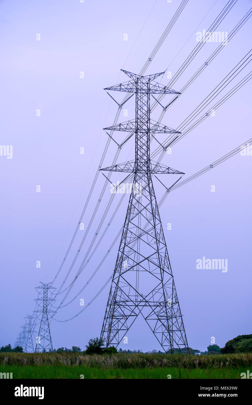 high voltage power lines during fiery sunset Stock Photo - Alamy