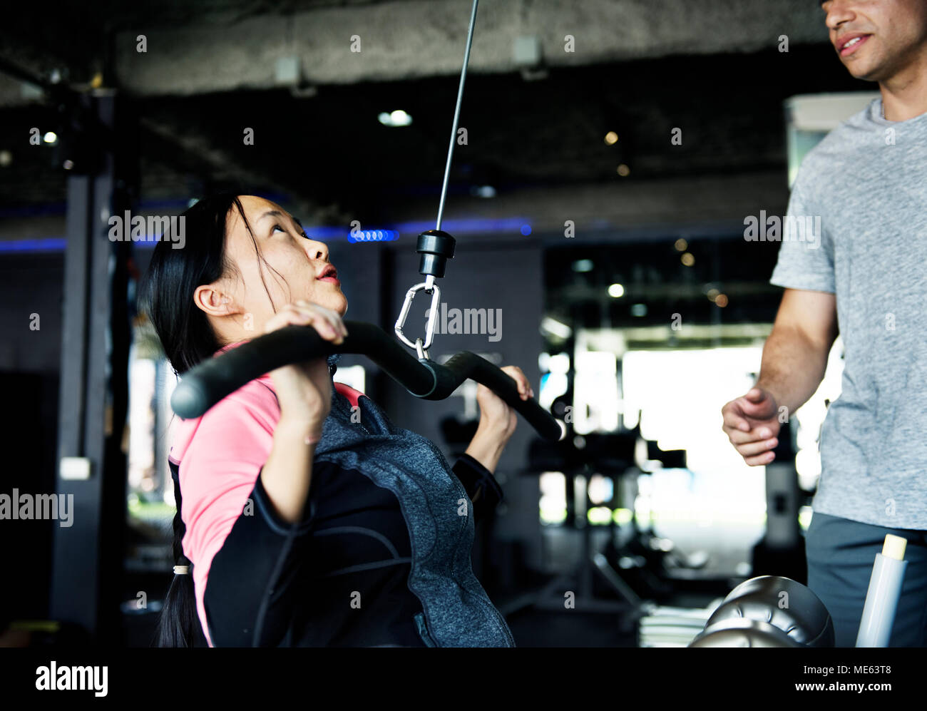 People exercising at fitness gym Stock Photo - Alamy