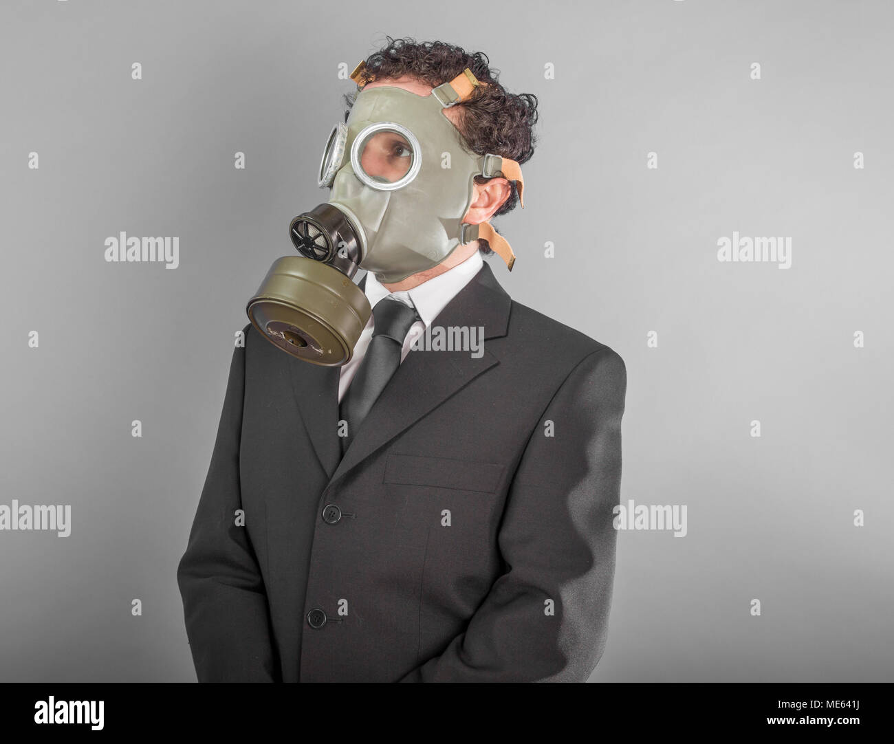 Portrait of a businessman wearing a gas mask Stock Photo - Alamy