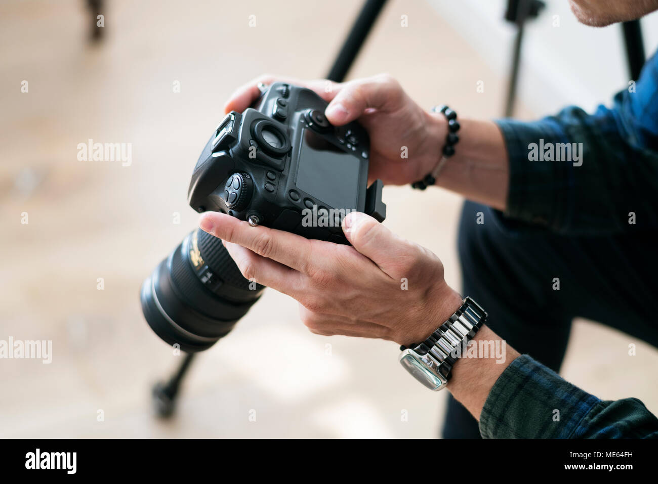 A man checking camera record Stock Photo - Alamy