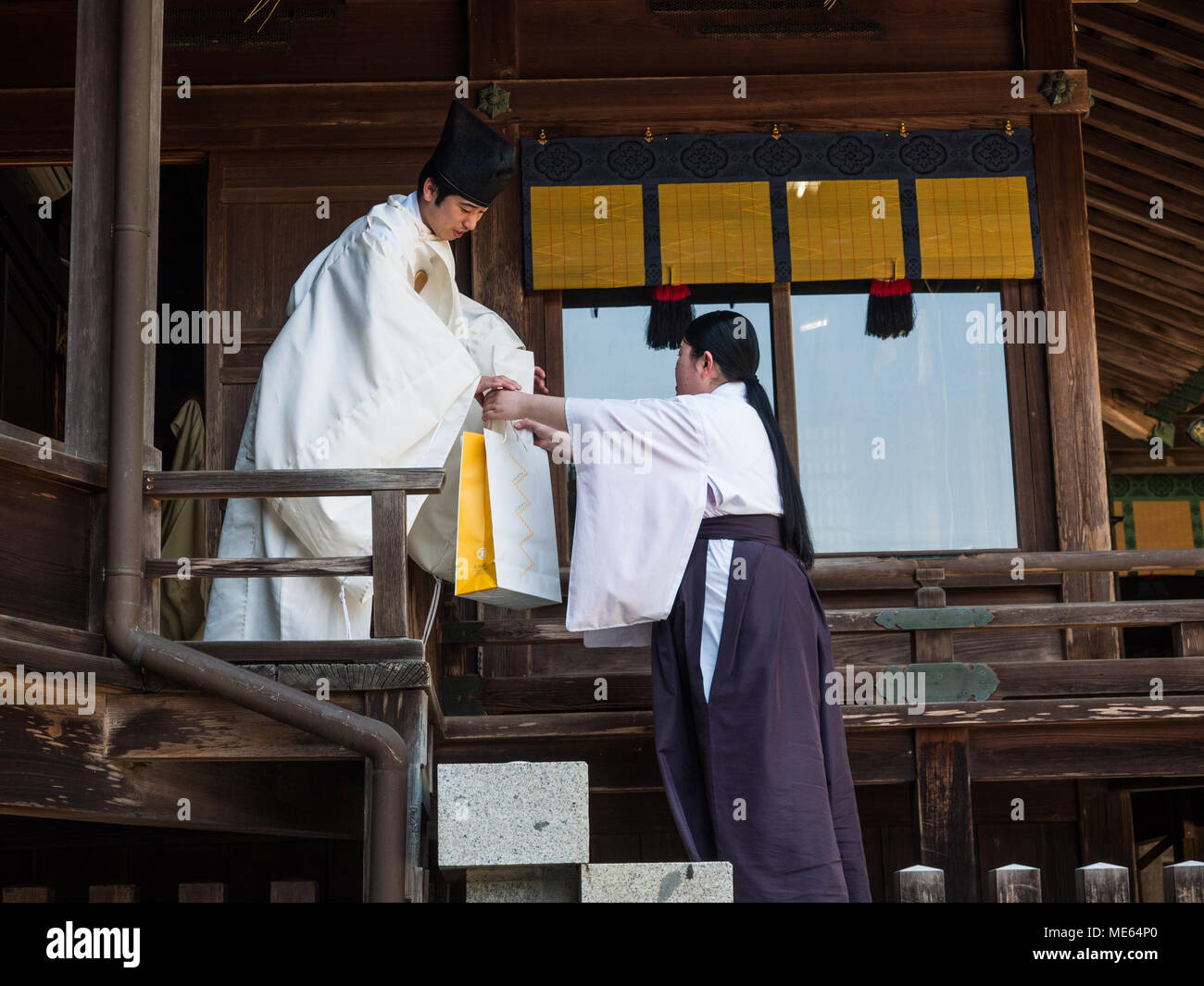 Priest and shrine mainden, miko in traditional formal costume, Konpira ...