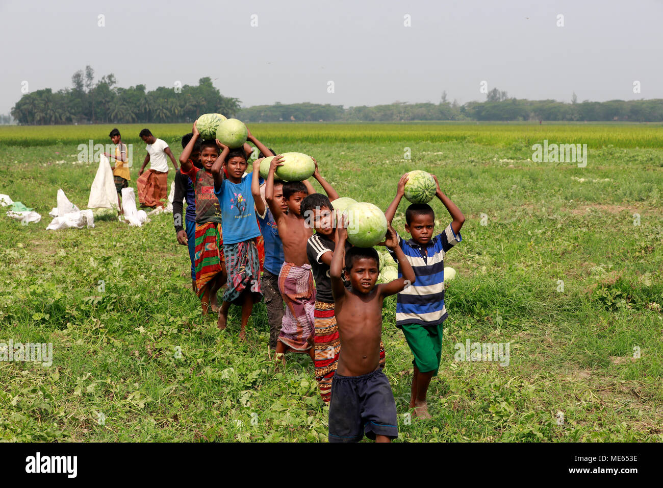 Noakhali, Bangladesh – April 06, 2018: Bangladeshi children carry ...