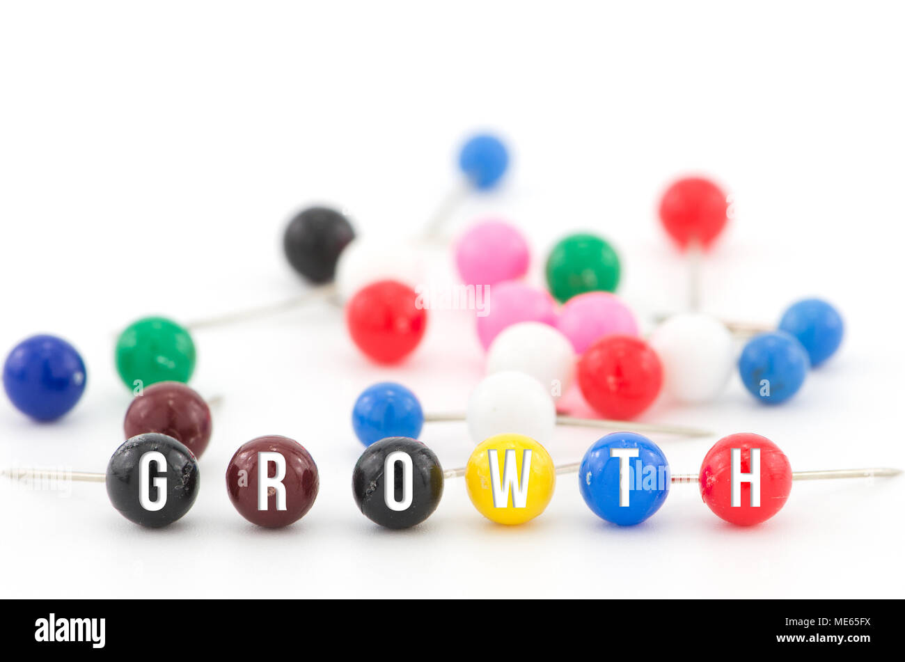 Growth, colorful paper pins with conceptual words. Isolated on white ...