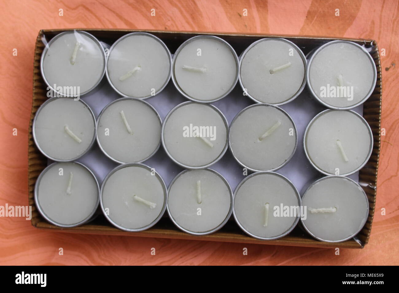 Tea light candles packed inside a box Stock Photo - Alamy