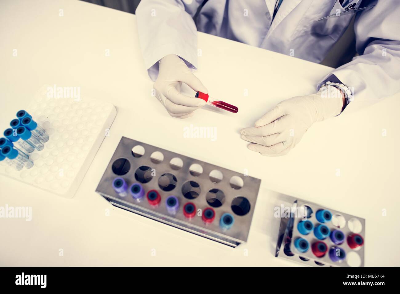 Woman checking test tubes scientist hi-res stock photography and images ...