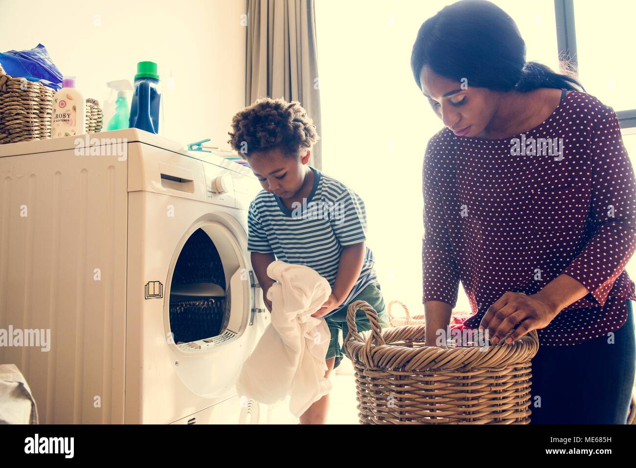 Mother and son doing housework together Stock Photo - Alamy