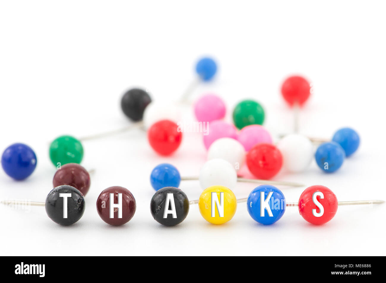 Thanks, colorful paper pins with conceptual words. Isolated on white ...