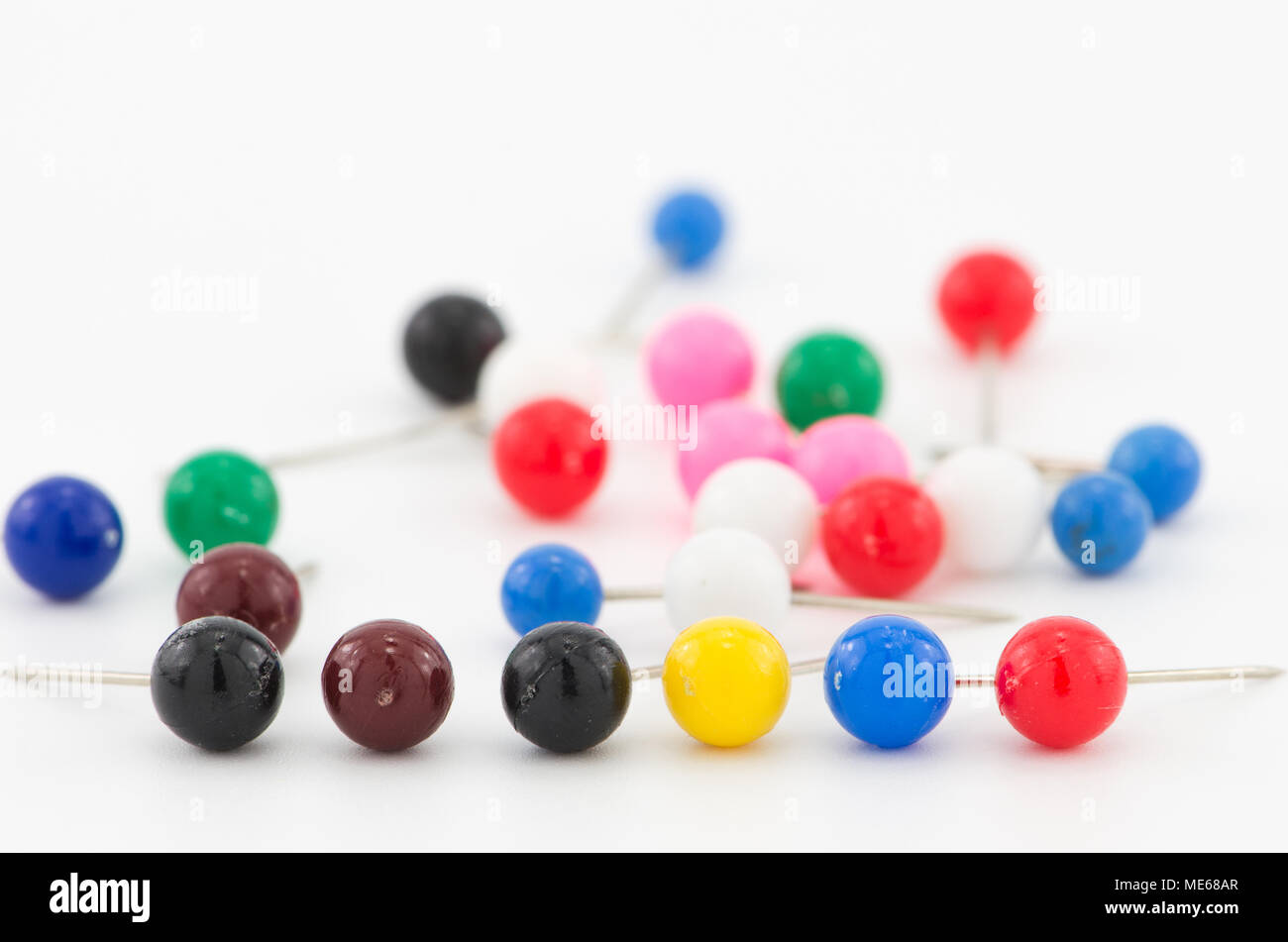 Colorful paper pins with conceptual words. Isolated on white background ...