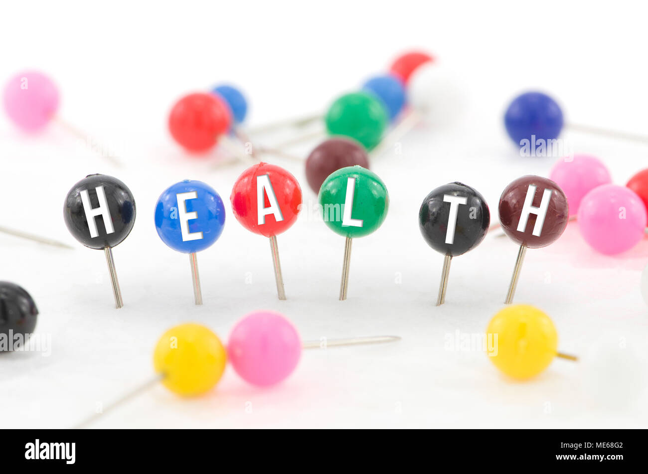 Health, colorful paper pins with conceptual words. Isolated on white ...