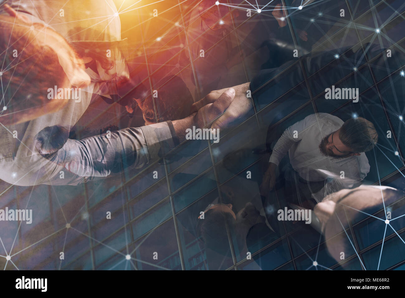 Handshaking business person in office with network effect. concept of ...