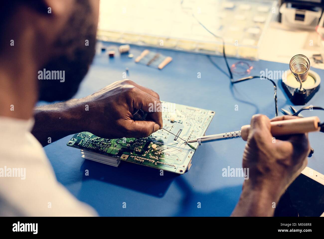 Closeup of tin soldering with electronics circuit board Stock Photo - Alamy