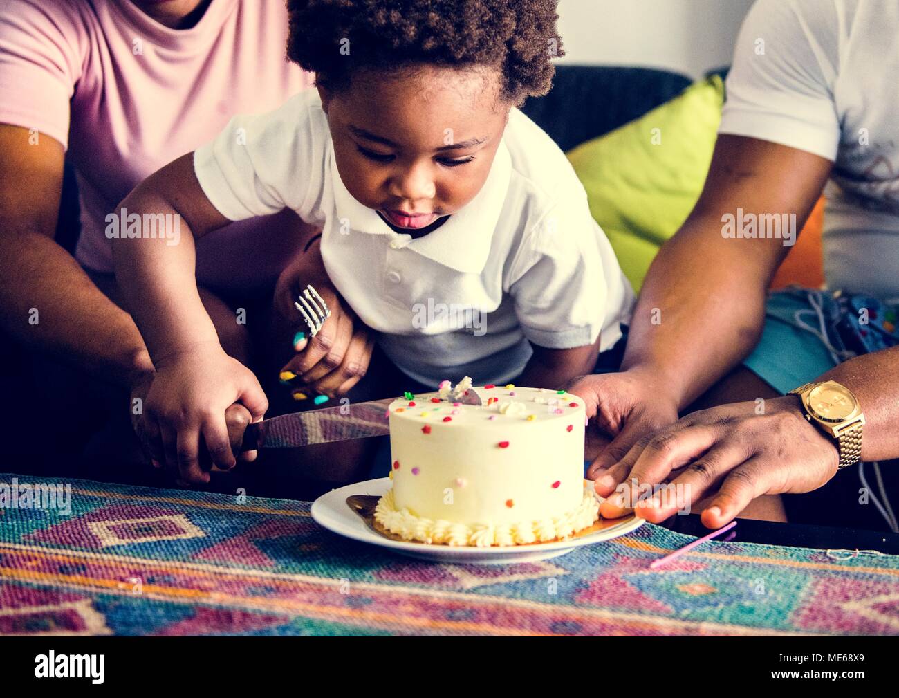 Child cutting birthday cake hi-res stock photography and images - Alamy