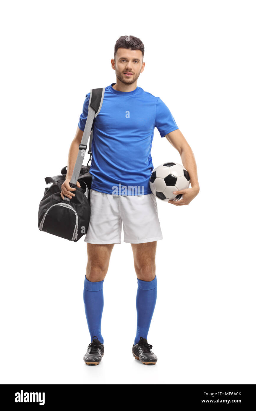 Full length portrait of a soccer player with a sports bag and a ...
