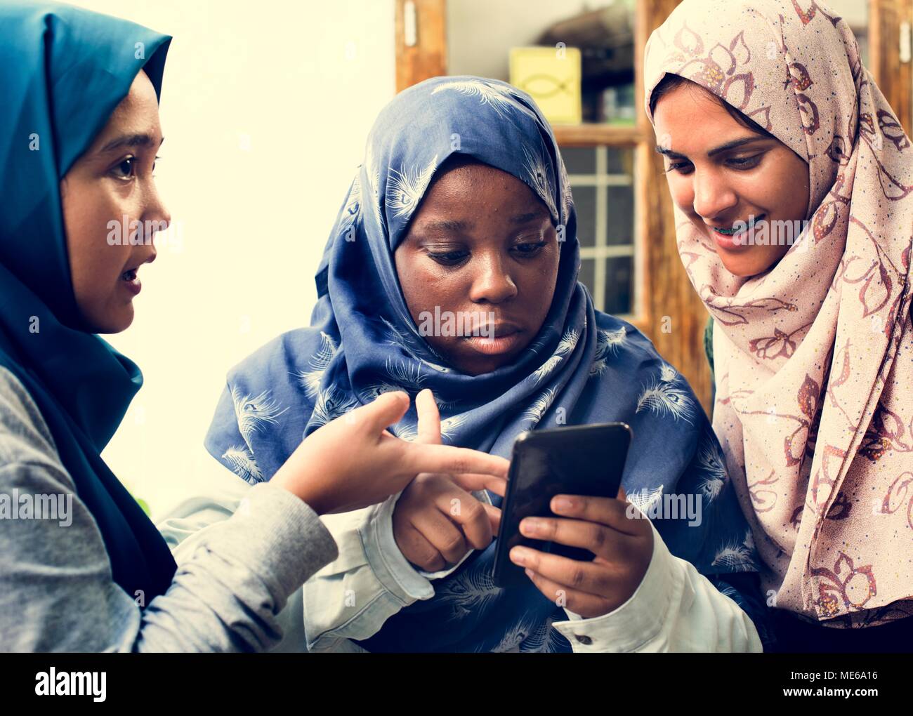 Group of students using mobile phone Stock Photo - Alamy