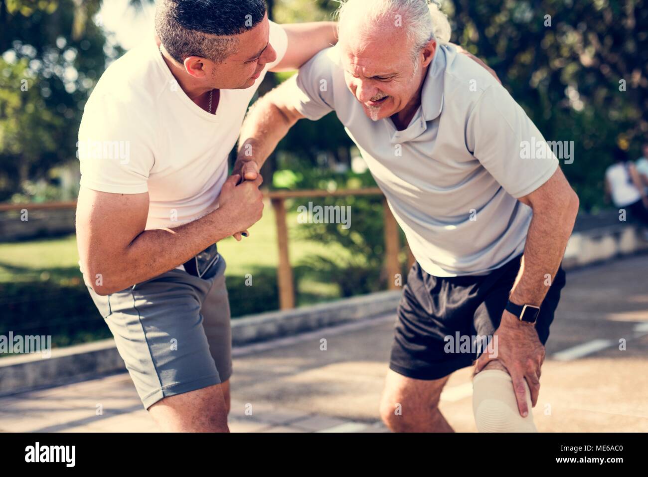 Helping leg injury support walking hi-res stock photography and images ...