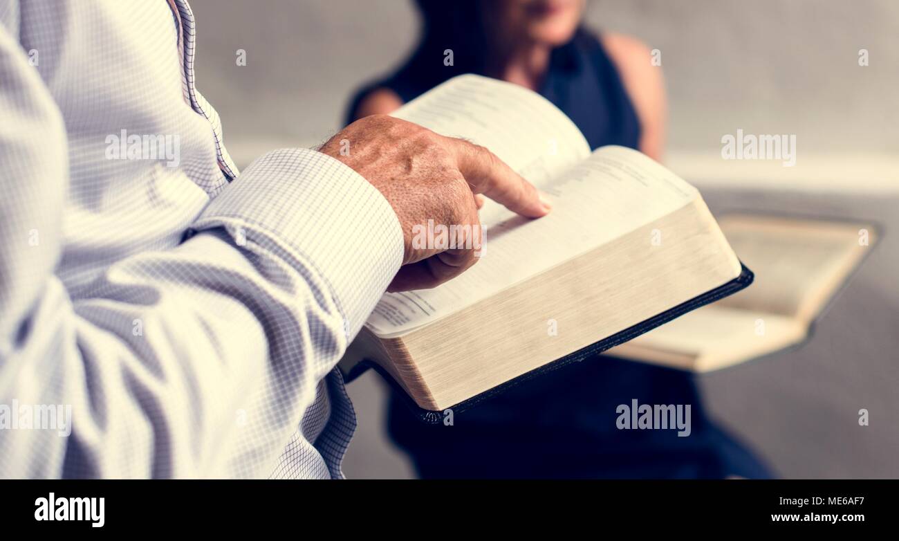 Group of christianity people reading bible together Stock Photo - Alamy