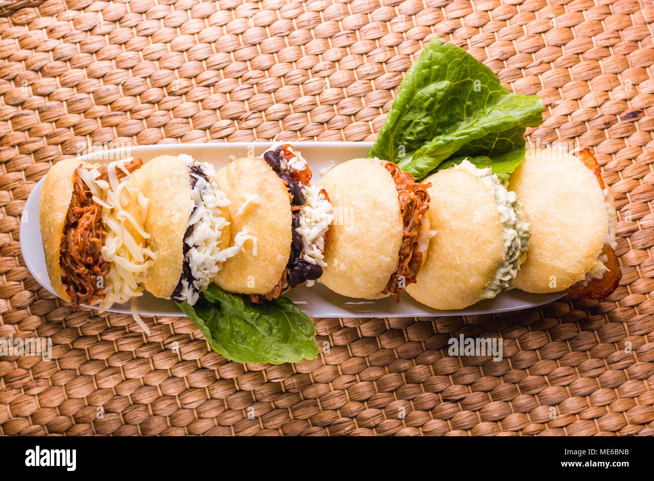 Different types of arepas, meat, black beans, cheese, fried plantain ...