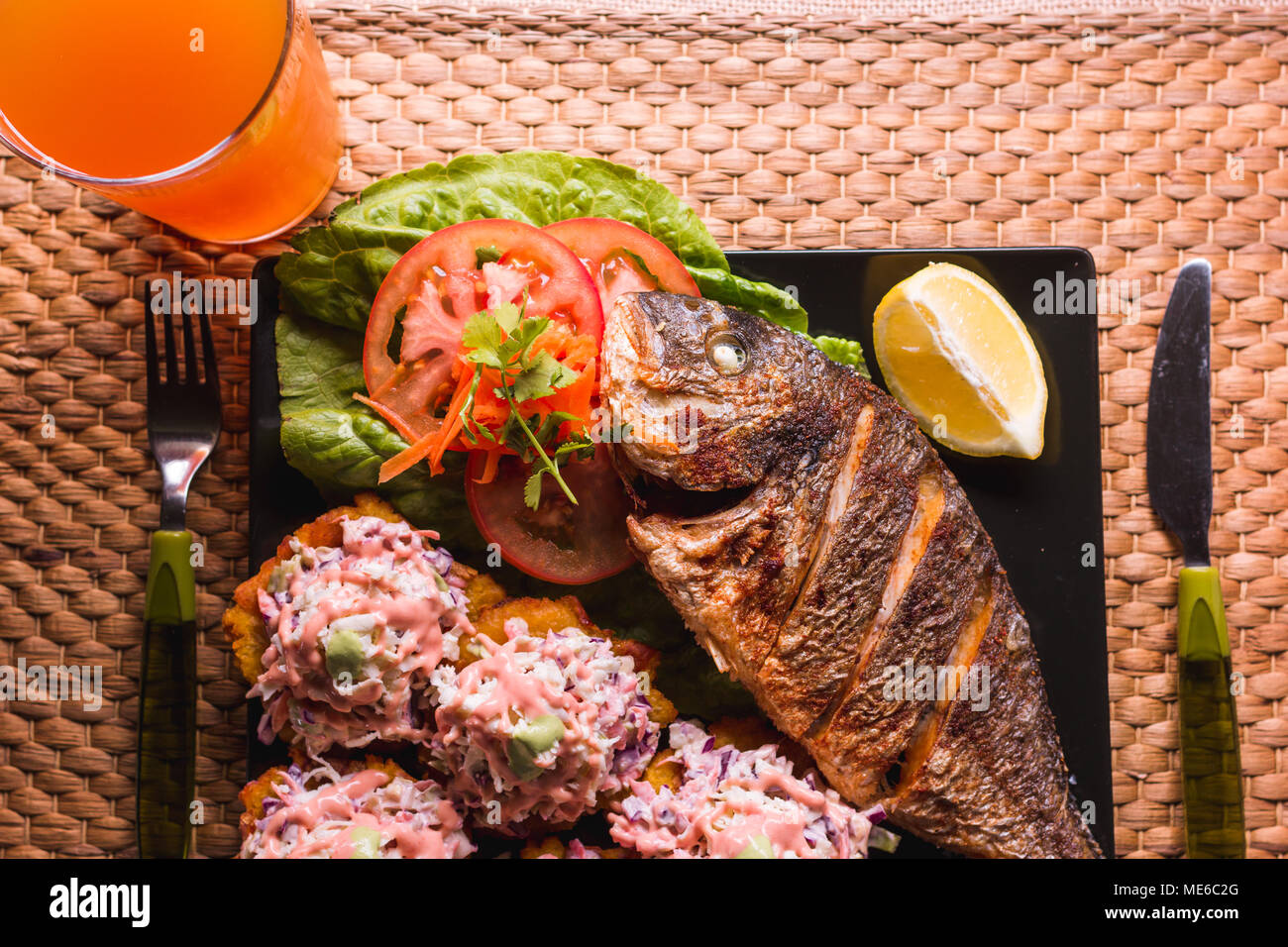 Whole fried fish and rice hi-res stock photography and images - Alamy
