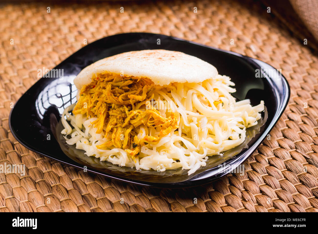 Venezuelan breakfast, Arepa, corn tortilla with chicken and yellow ...
