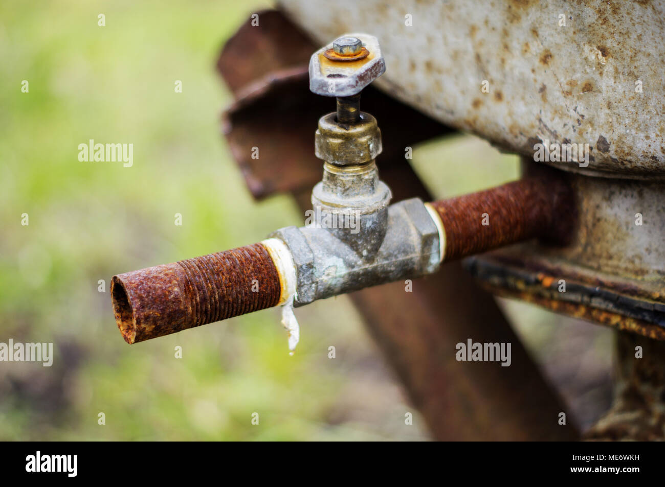 old rusty industrial tap water pipe and valve. For your commercial and ...