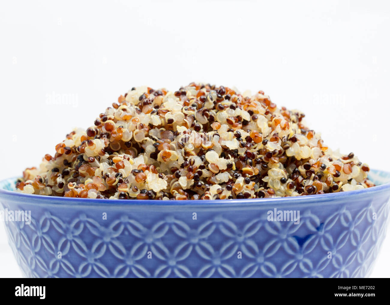 Black, red and white quinoa that has been boiled and then simmered ...