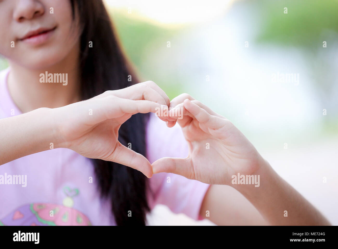 girl with Heart-shaped hand Stock Photo - Alamy