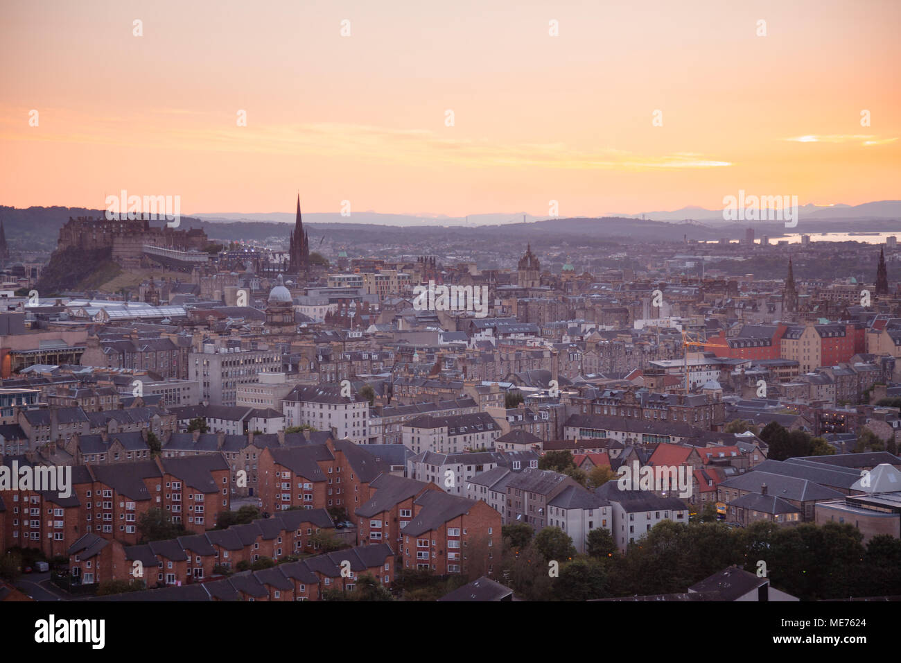 Edinburgh cityscape with Edinburgh Castle in background at sunset as ...