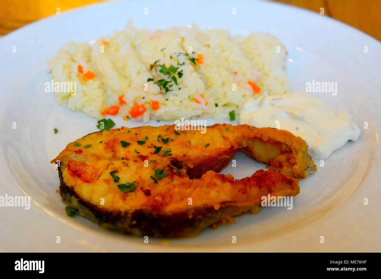 Fish dinner with rice and tomatoes hi-res stock photography and images ...
