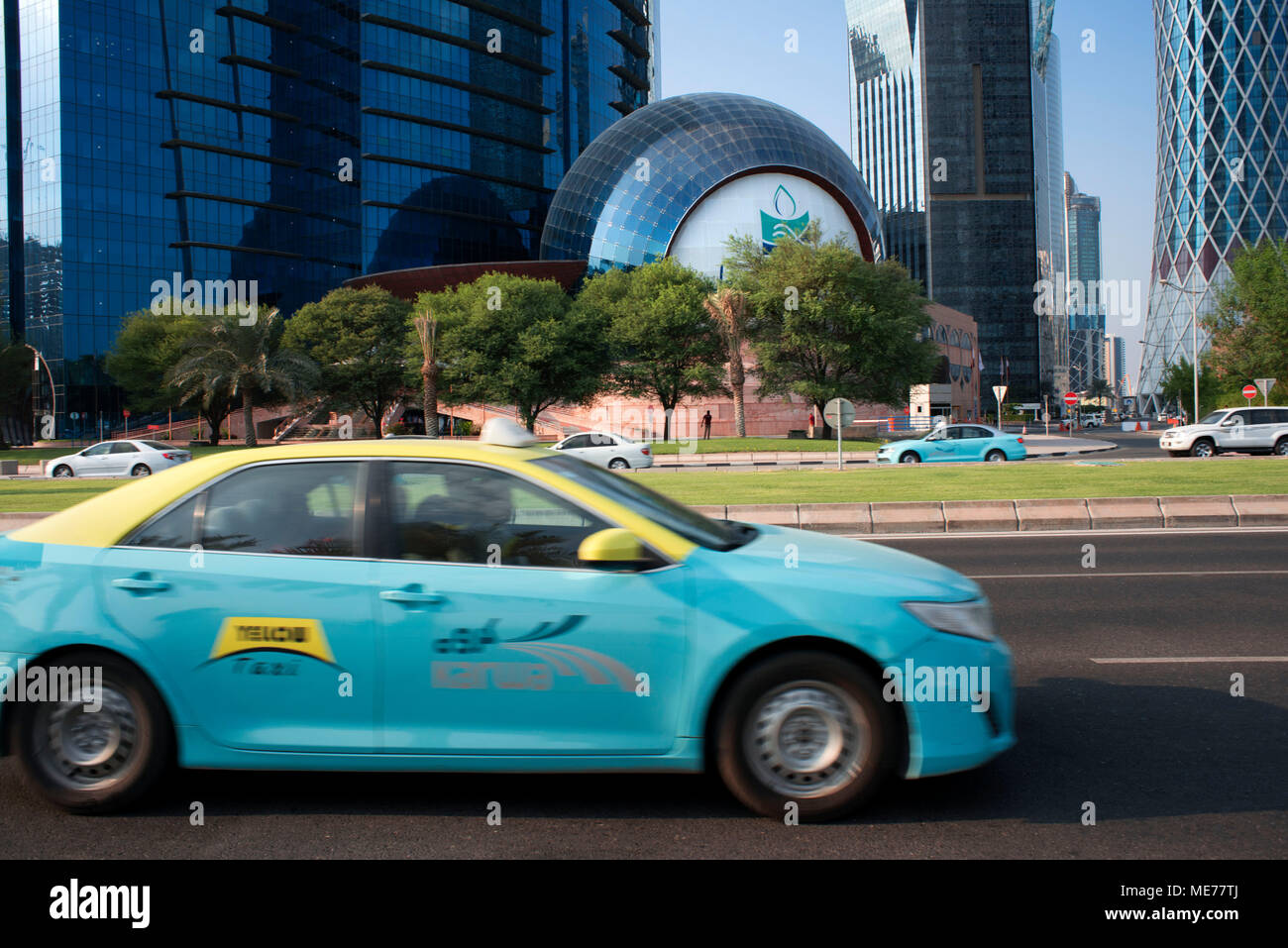 Taxi in front of Qatar petroleum Building in the financial area of Doha ...