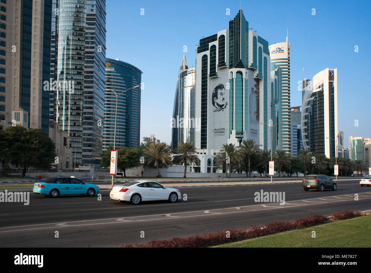 Taxi in Al Corniche street in the financial area of Doha, the capital ...