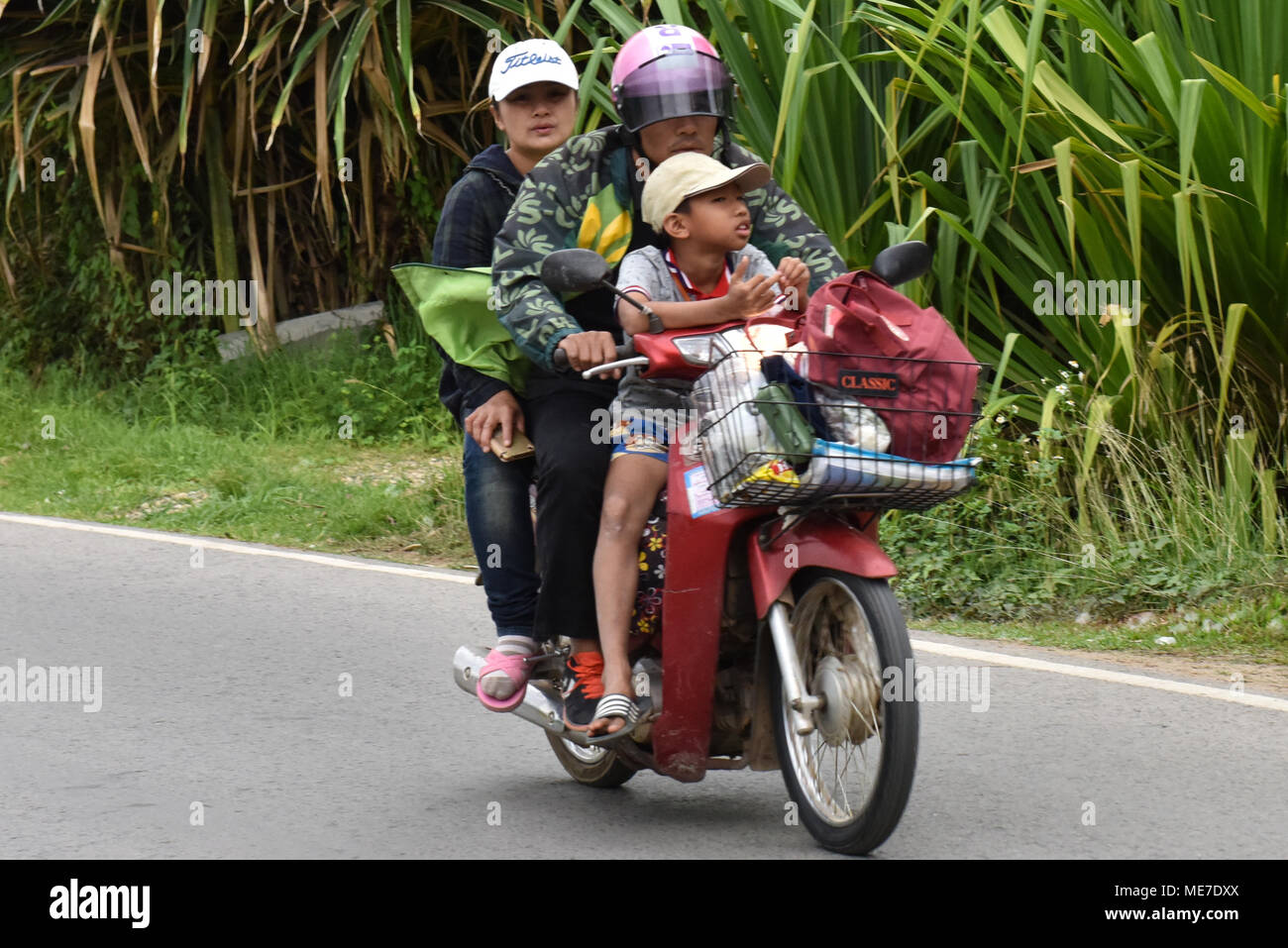 Thai family on motorcycle hi-res stock photography and images - Alamy