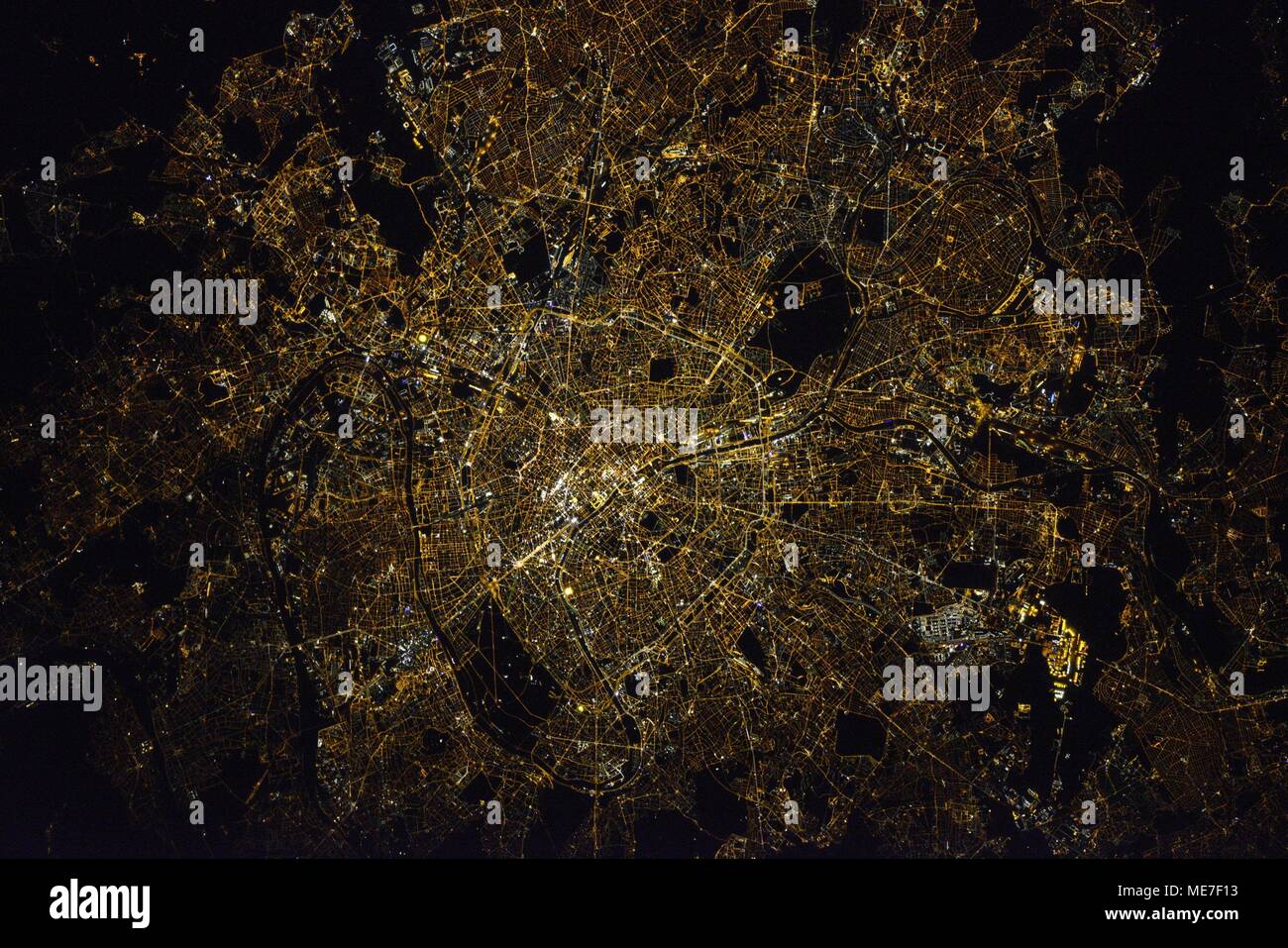 A satellite view of the city lights at night in Paris, France as seen ...