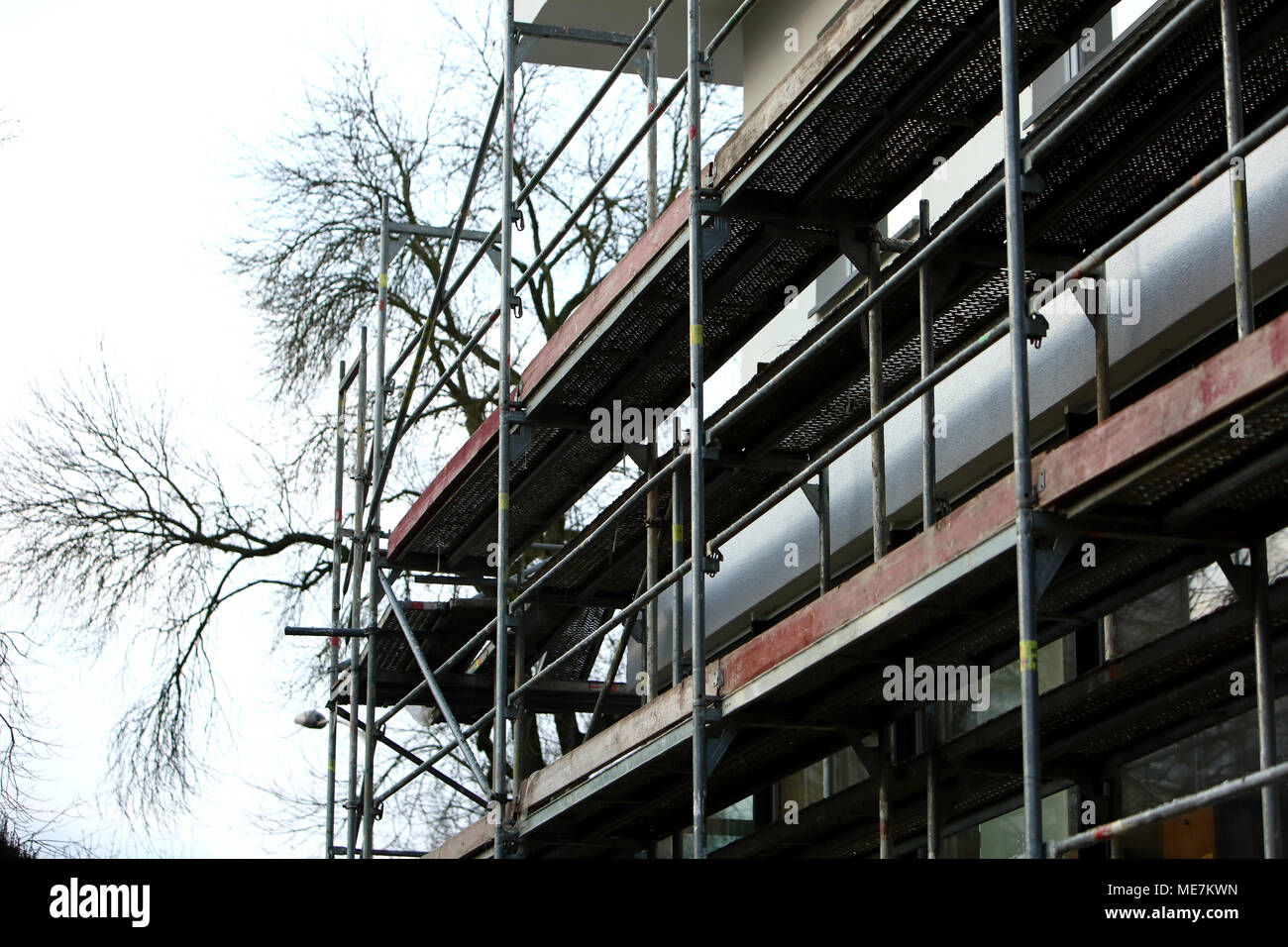 Steel scaffolding placed outside the high building for its renewal ...