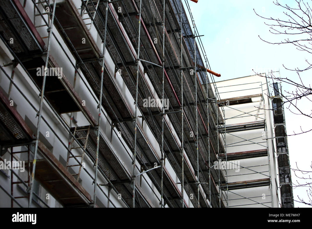 Steel scaffolding placed outside the high building for its renewal ...