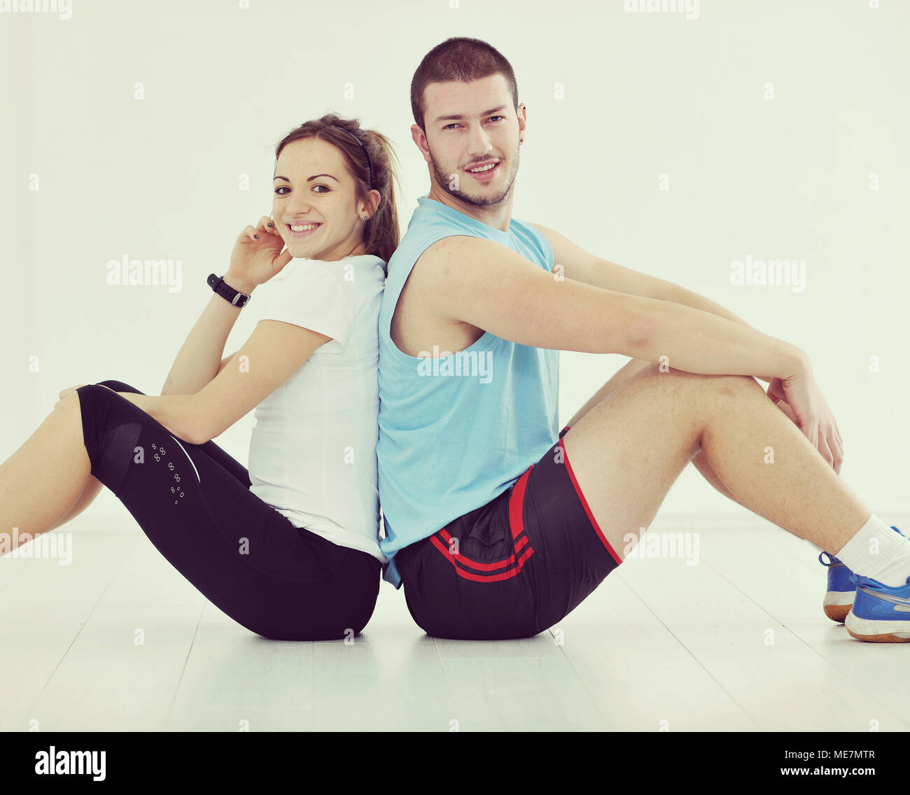 happy young couple fitness workout and fun at sport gym club Stock ...