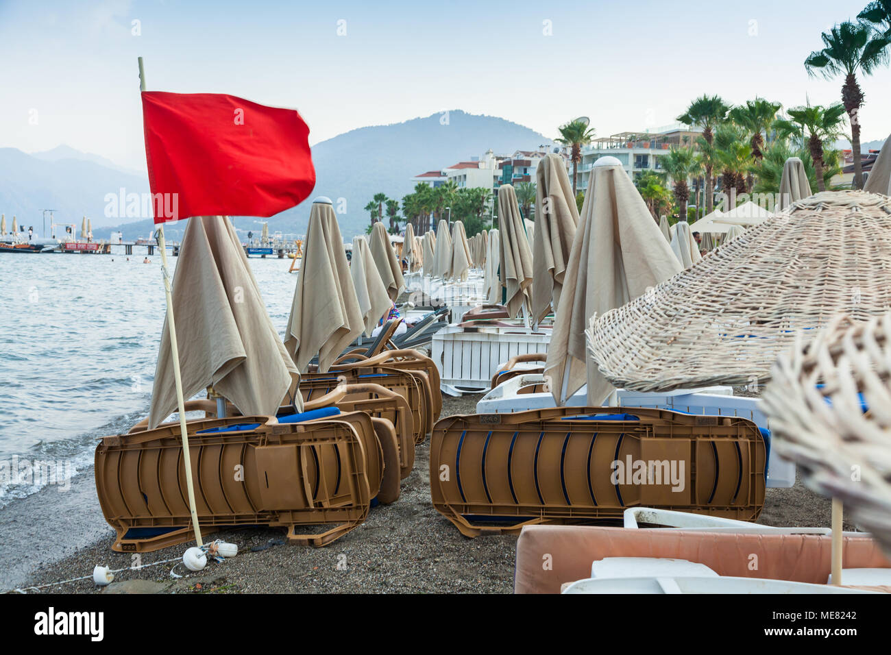 Red flag on the beach of Marmaris Stock Photo - Alamy