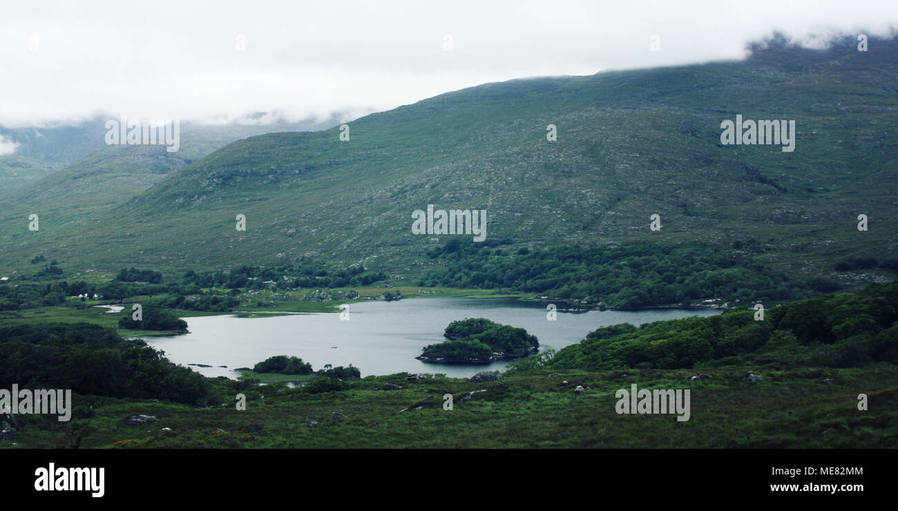 Lake and green hills. A scenic view of a Kerry Mountains and ...