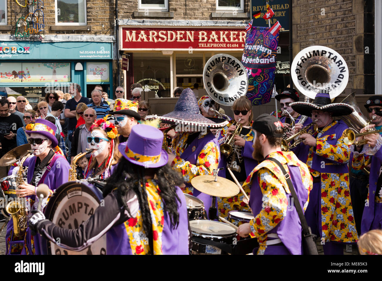 Marsden, UK. 21st April, 2018. A colourful street band at the Marsden ...