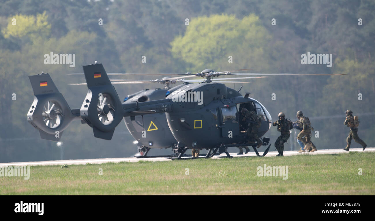 19 April 2018, Germany, Schoenefeld: Soldiers in two Eurocopter ...