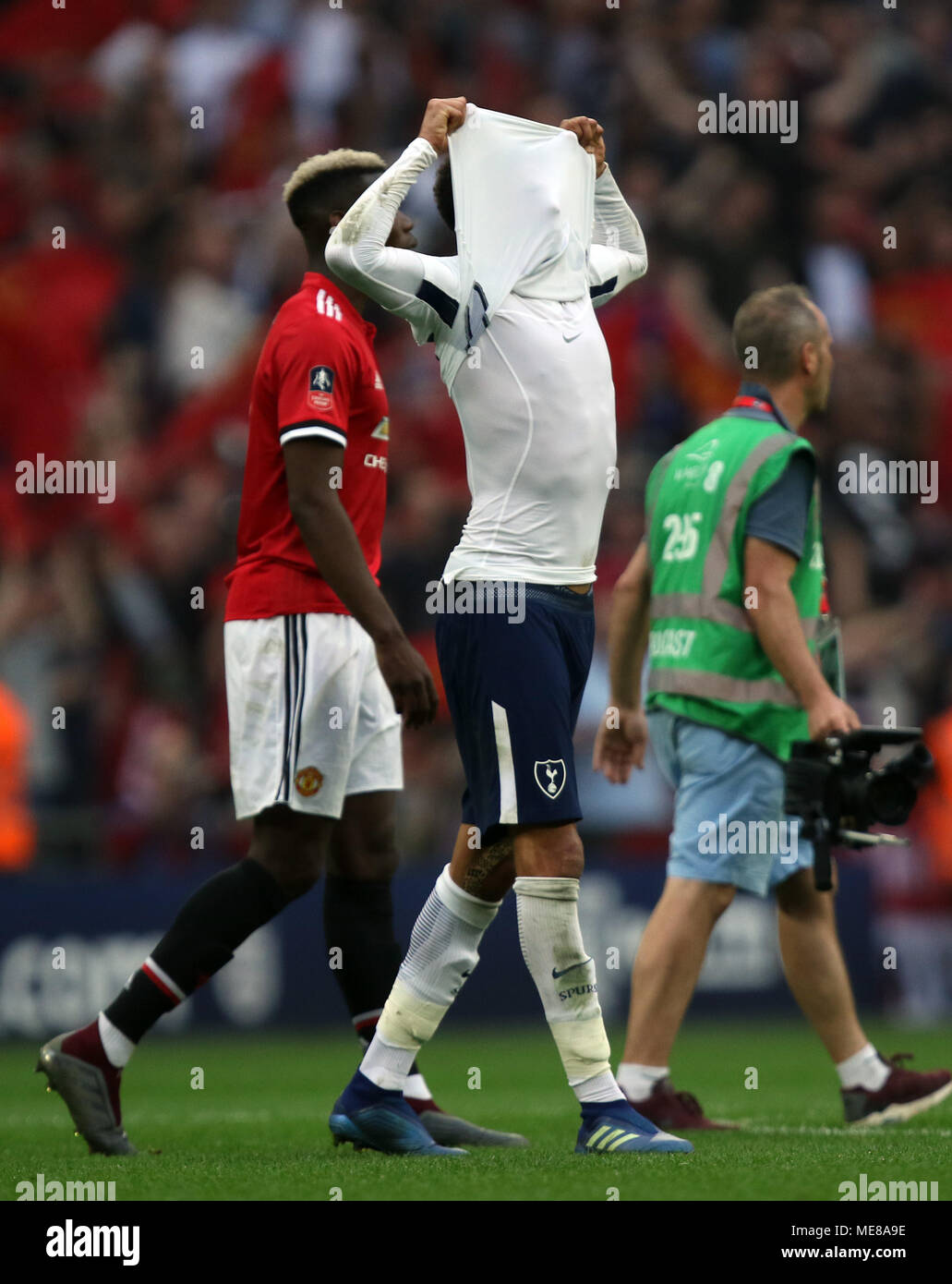 London, UK, 21 April 2018. Dele Alli (TH) covers his face after defeat ...