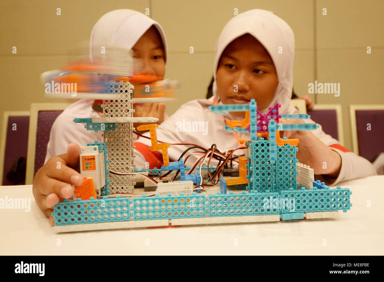 South Tangerang, Indonesia. 22nd Apr, 2018. Two girls prepare their ...