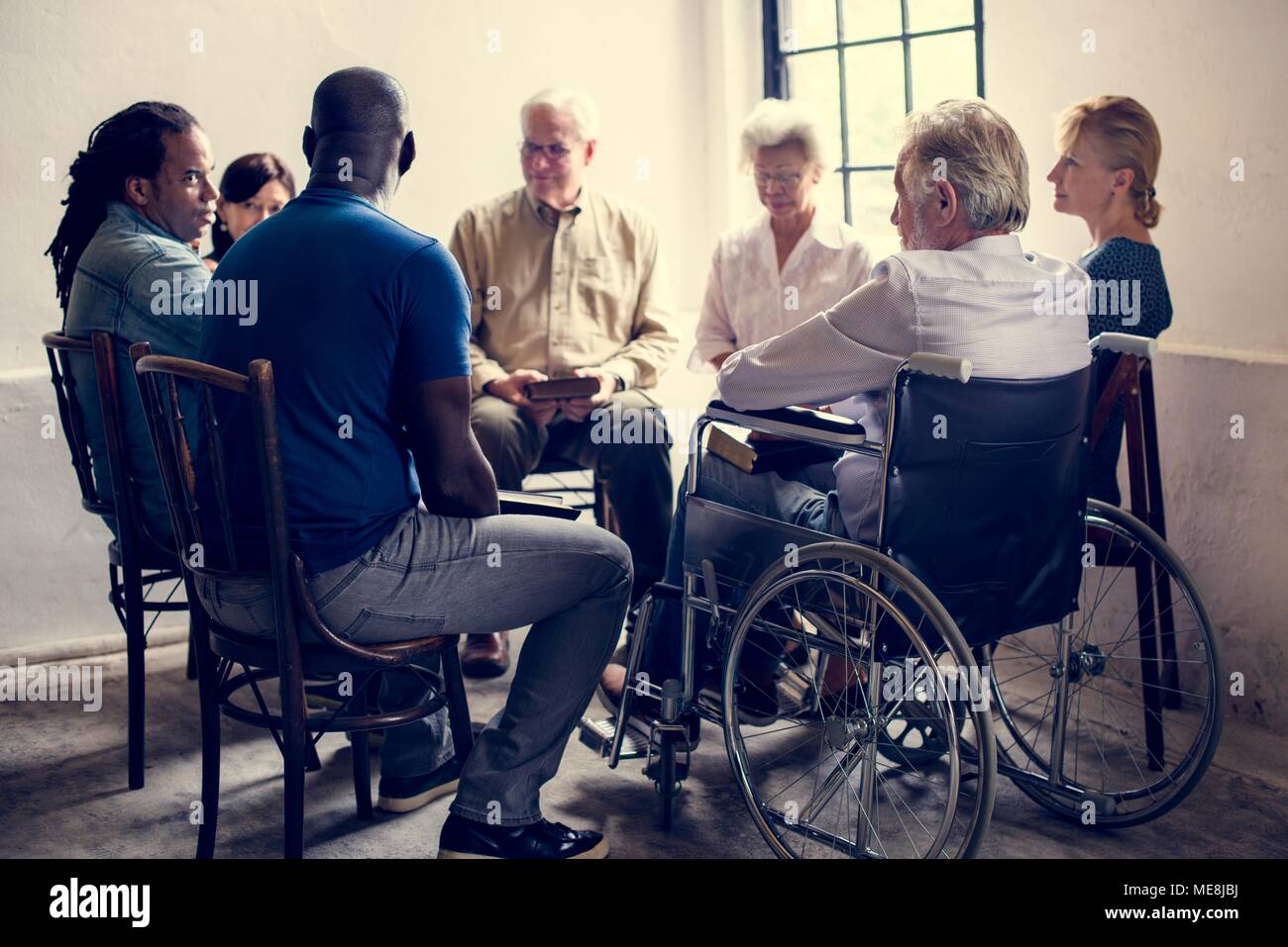 Group of diverse elderly gathering together Stock Photo - Alamy