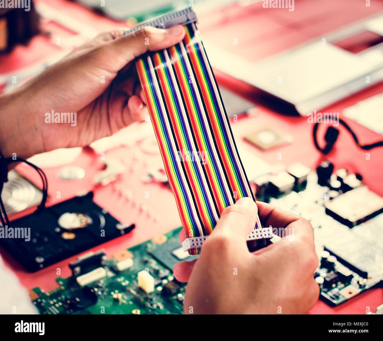 Clsoeup of hands holding computer breadboard flat wires cables Stock ...